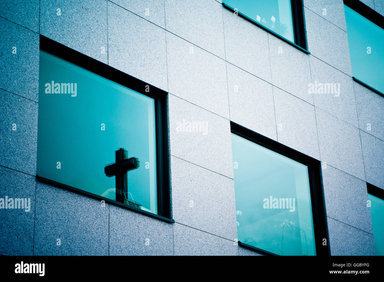 cross reflected into a window of a modern building Stock Photo - Alamy