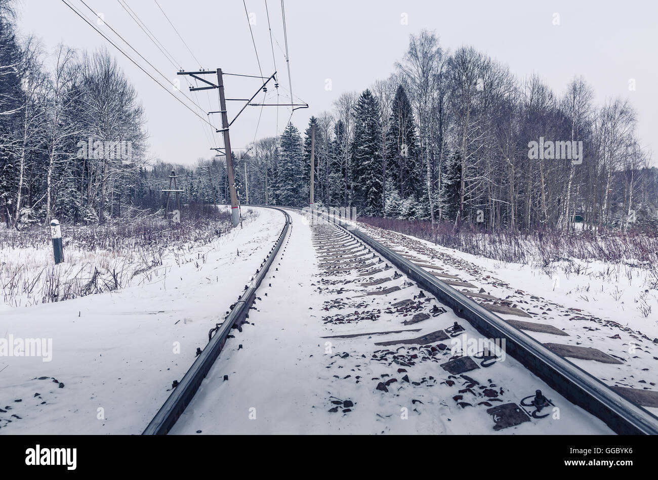Snow covered railway crossing Stock Photo - Alamy