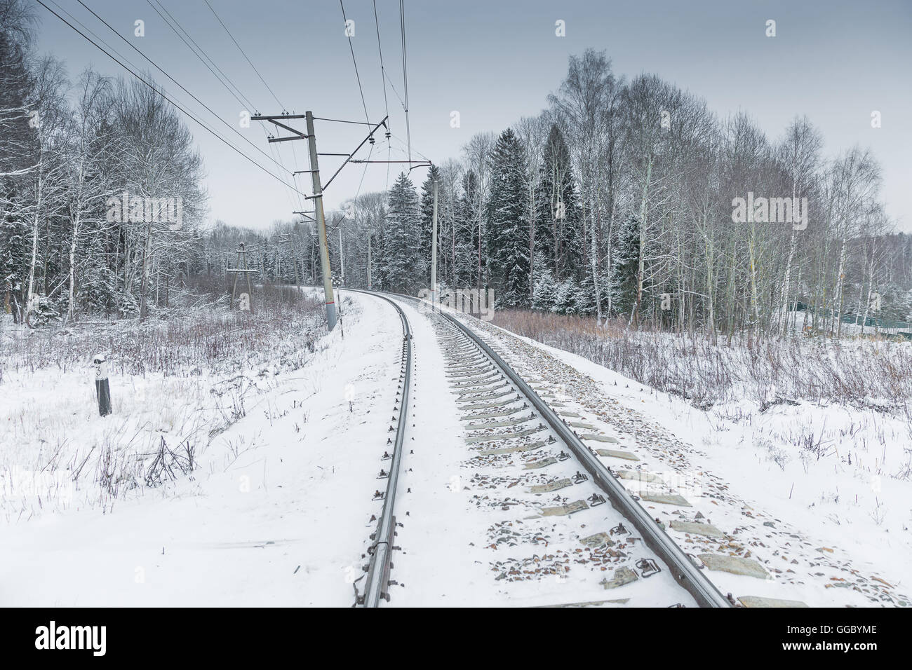 Snow covered railway crossing Stock Photo - Alamy