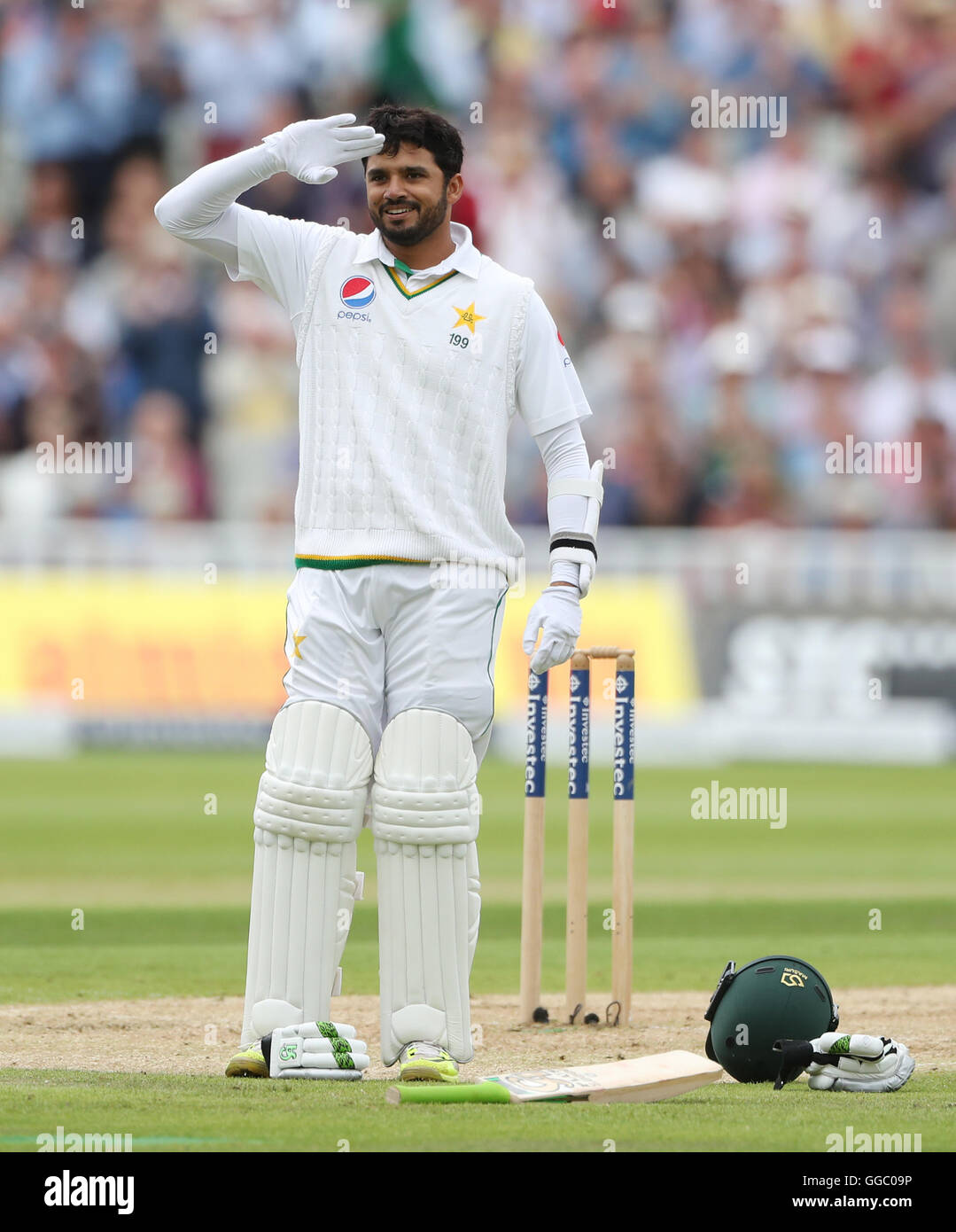 Pakistan batsman Azhar Ali celebrates his 100 not out watched by ...