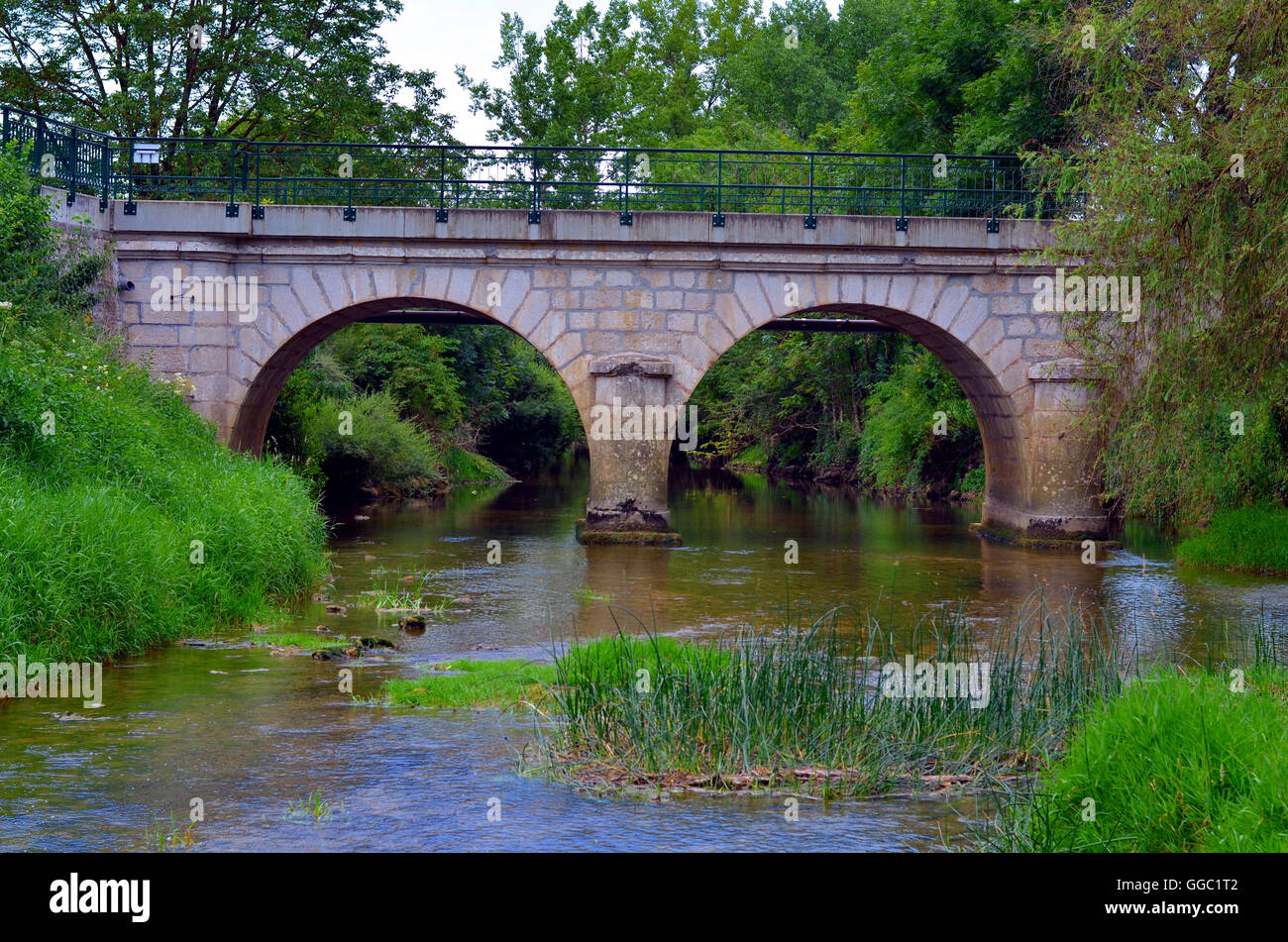 medieval stone bridge at a river in south france Stock Photo - Alamy