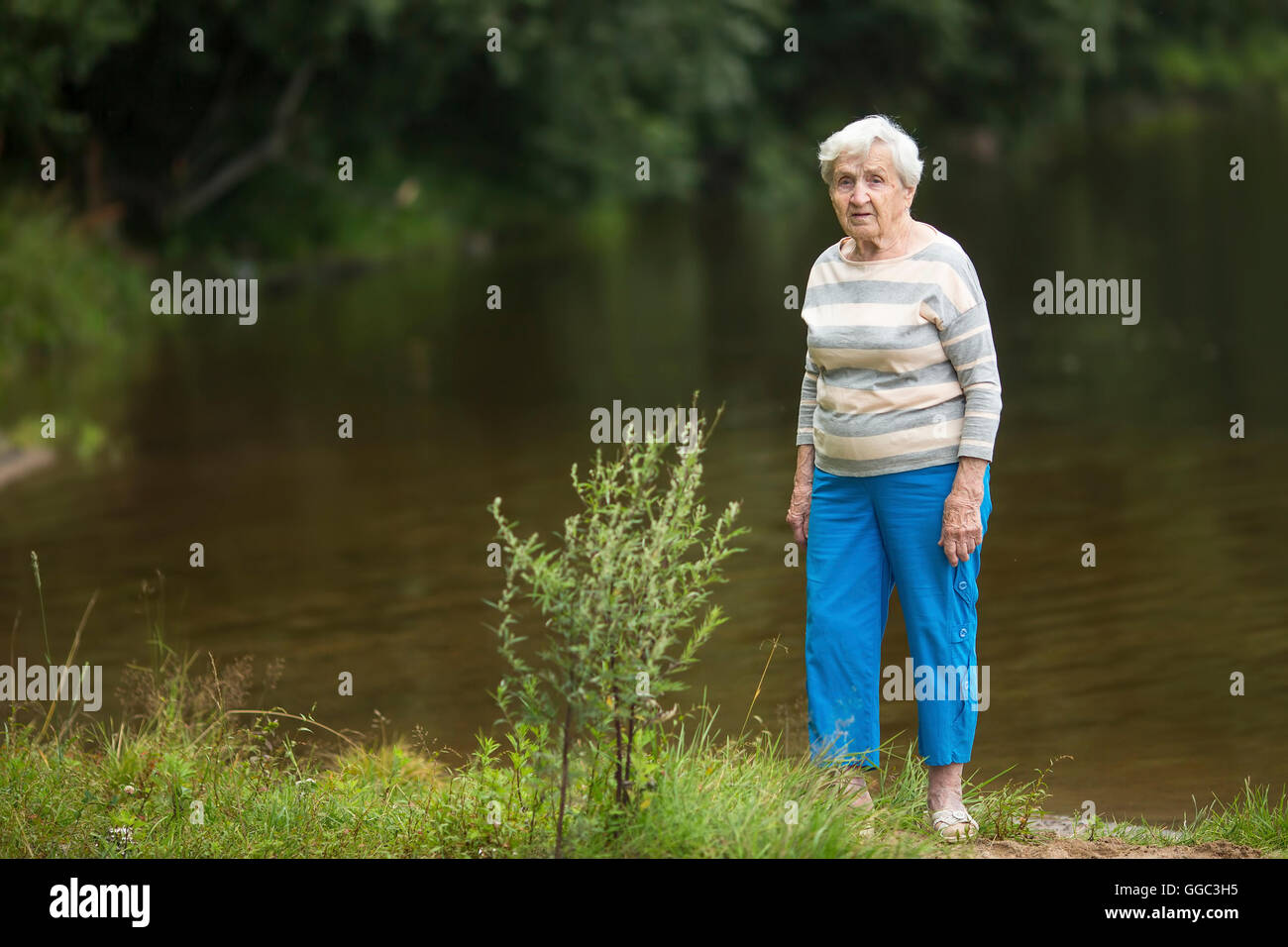 Woman stands on river hi-res stock photography and images - Alamy
