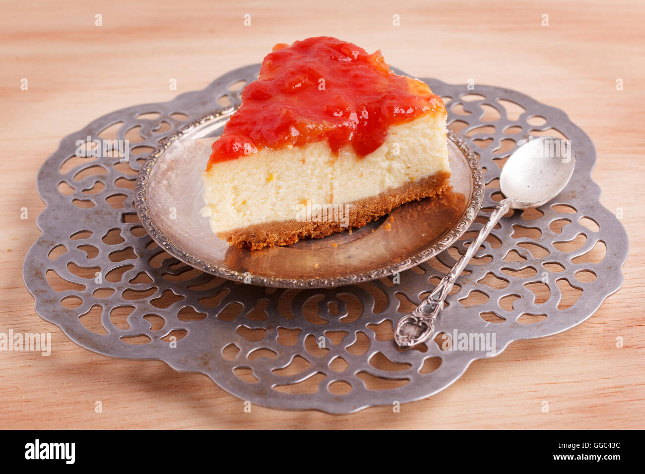 Cheesecake with brazilian goiabada jam of guava on silver vintage plate ...