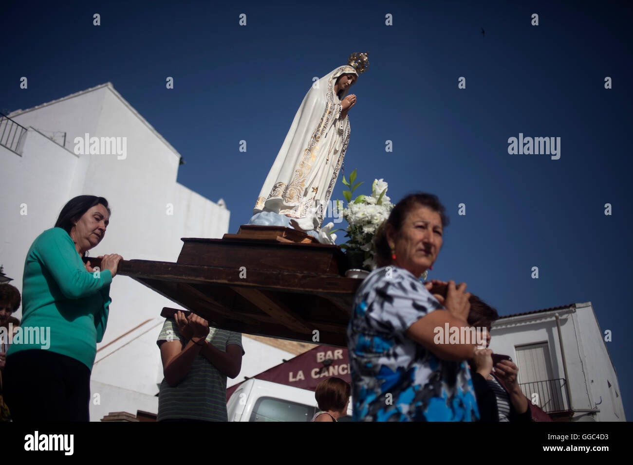 Women carry an image of Our Lady of Fatima displayed during a religious ...
