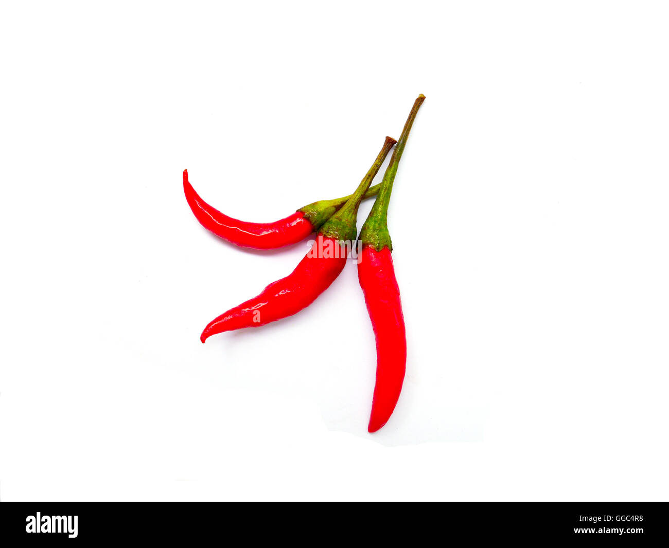 Three red chilli isolated on white background Stock Photo - Alamy