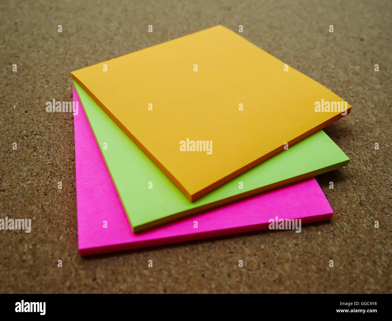 Three post note on wooden board Stock Photo - Alamy