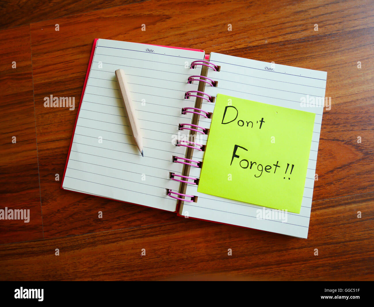 Don't forget post note with note book on top view Stock Photo - Alamy
