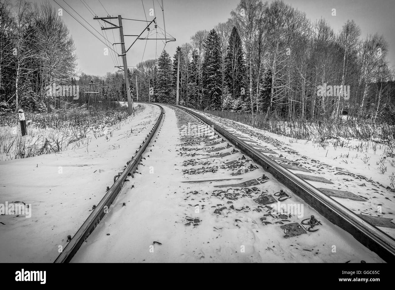 Snow covered railway crossing Stock Photo - Alamy
