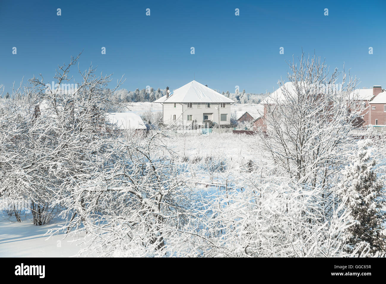 Country houses after snowfall Stock Photo - Alamy