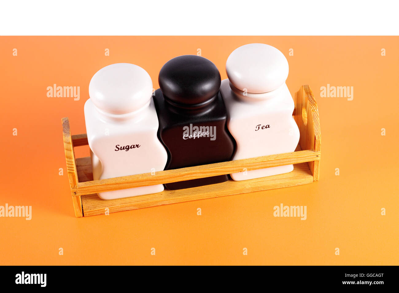 Capacities for condiment spices - Sugar, coffee, tea a set on a orange ...