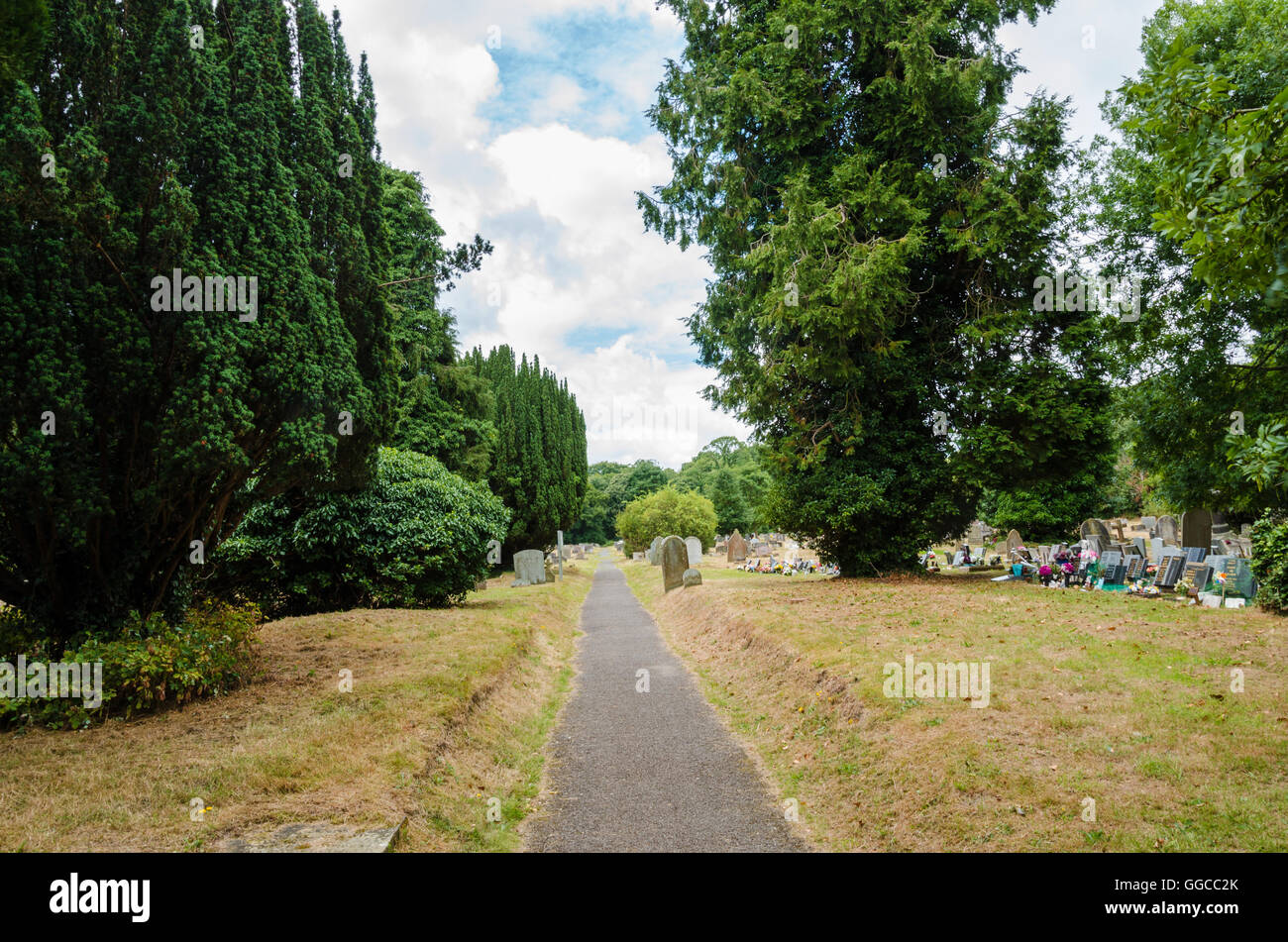 A path leading through St Michael's Church graveyard in Tilehurst ...