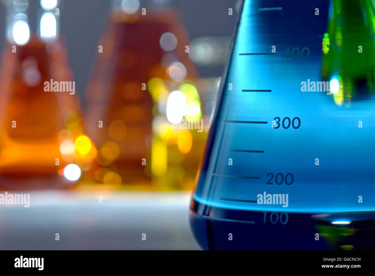 Laboratory glass conical Erlenmeyer flask filled with blue liquid for ...