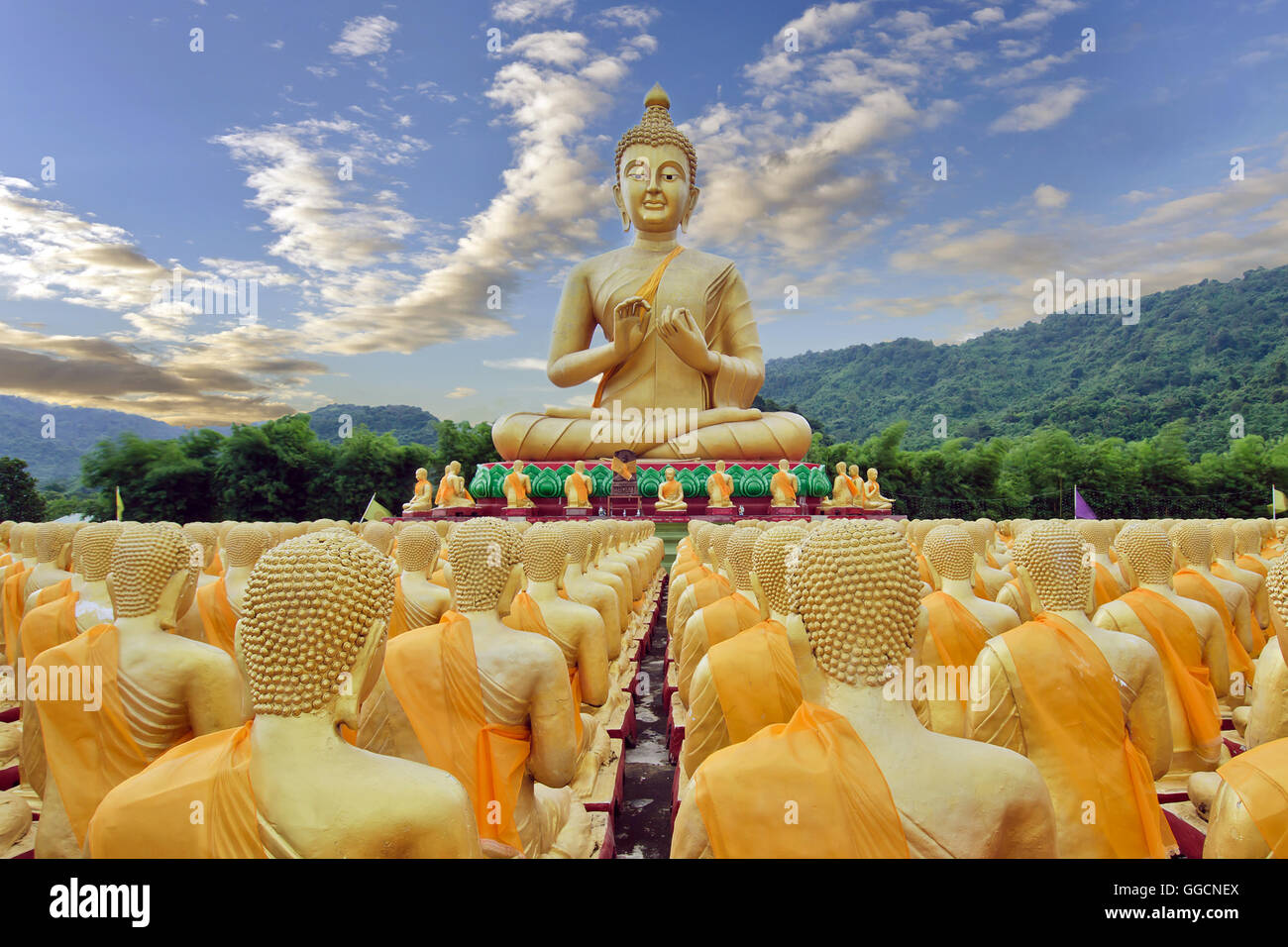 Buddha statue with sky and mountain at Buddha Maka Bucha park temple ...