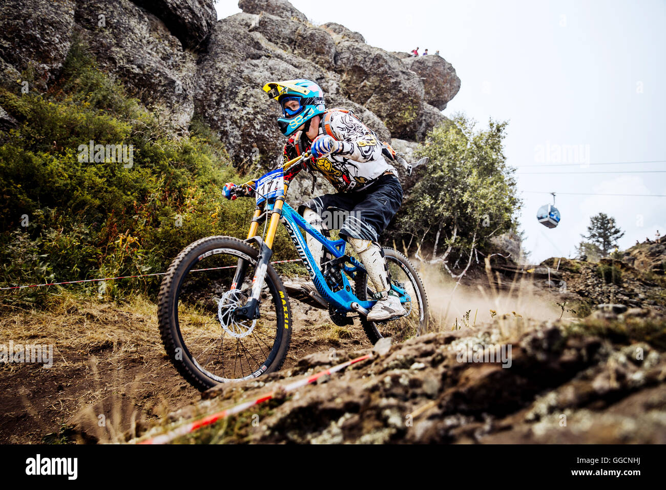 down on a mountain trail extreme athlete bike during National ...