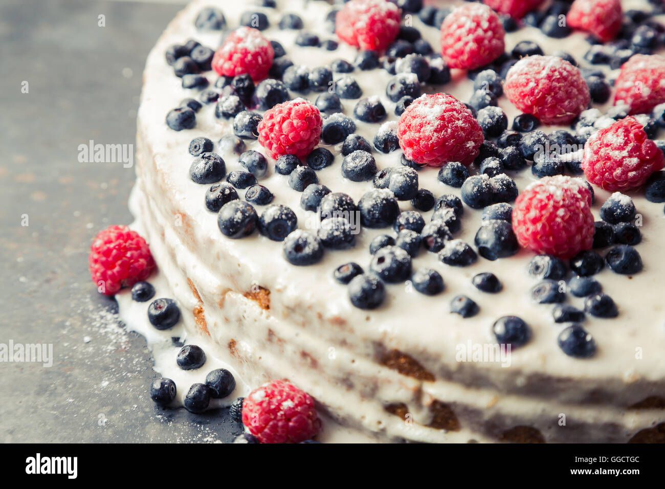 Homemade cake with blueberry and raspberry Stock Photo - Alamy