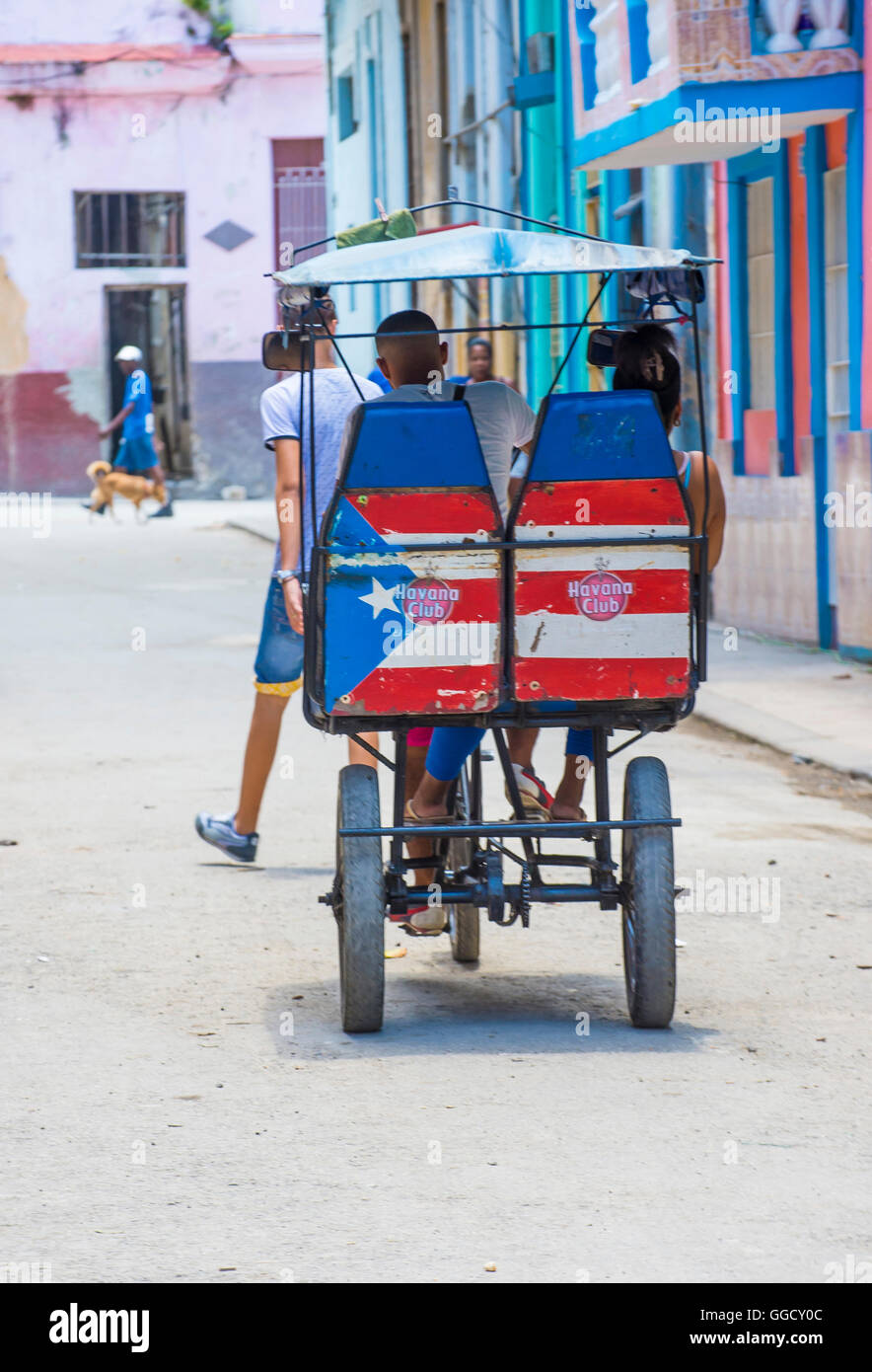 A Cuban rickshaw driver in old Havana street Stock Photo - Alamy
