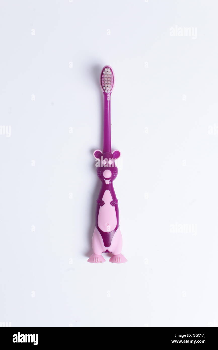 One purple baby toothbrush isolated over white background Stock Photo ...