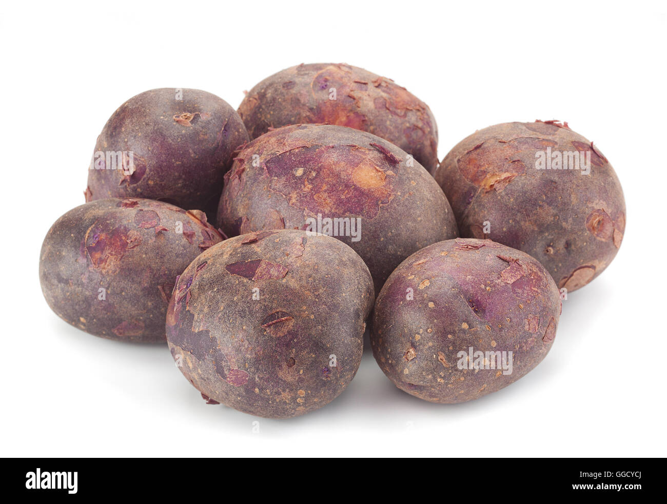 Young raw purple potatoes isolated on white background Stock Photo - Alamy