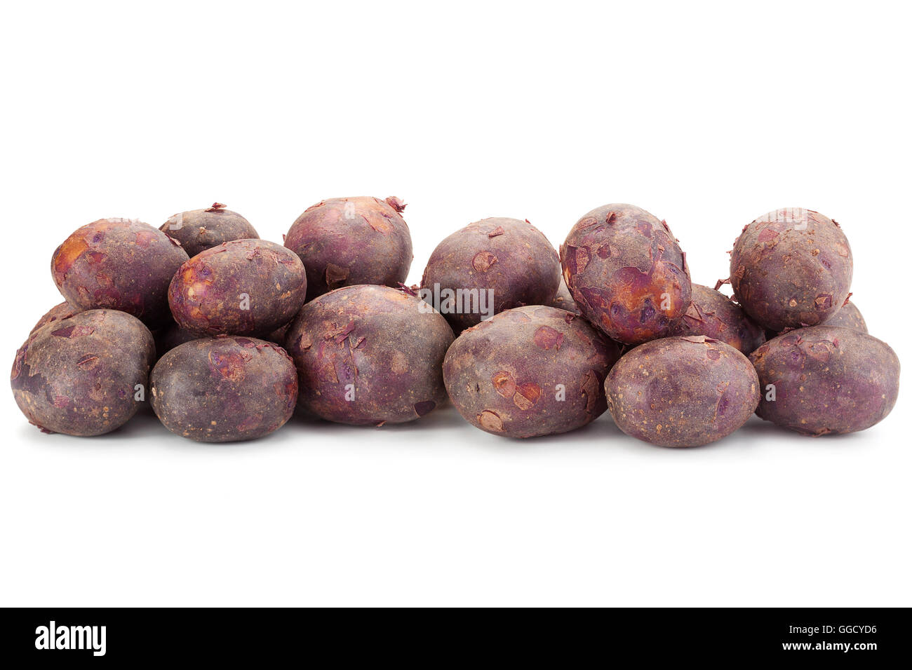 Young raw purple potatoes isolated on white background Stock Photo - Alamy