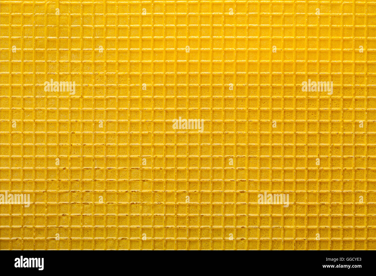 Yellow wafer textured surface closeup background Stock Photo - Alamy