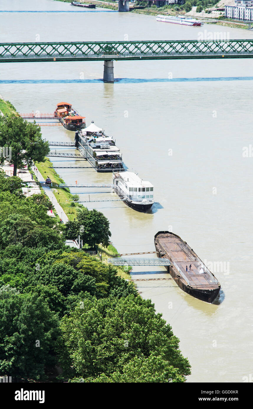 Ships, greenery and bridge over the Danube river in Bratislava city ...