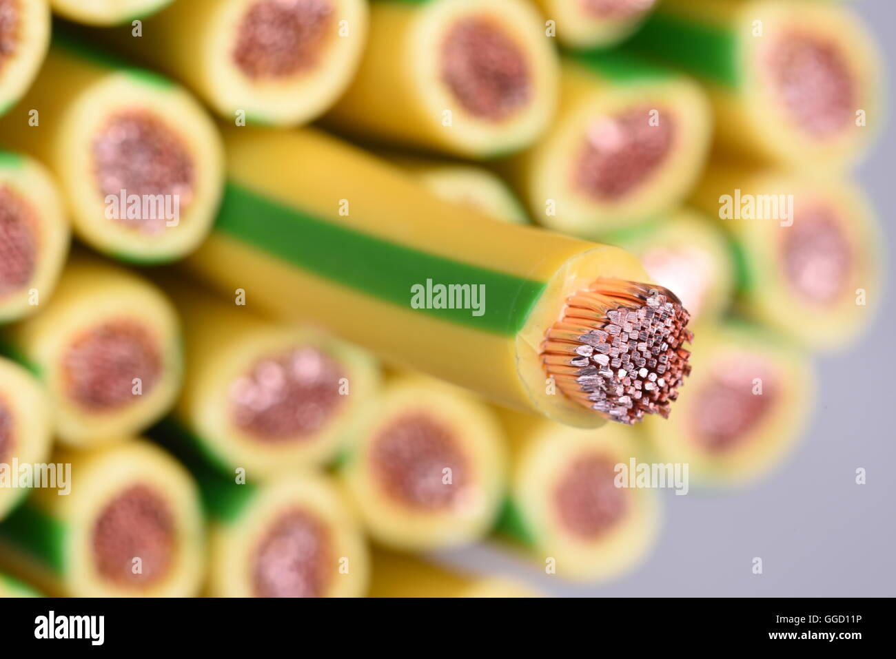Group of yellow and green earth cables and selective focus on one ...