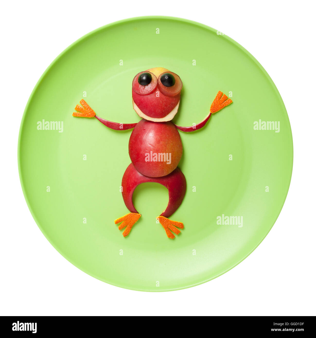 Frog made of red apple on green plate Stock Photo - Alamy
