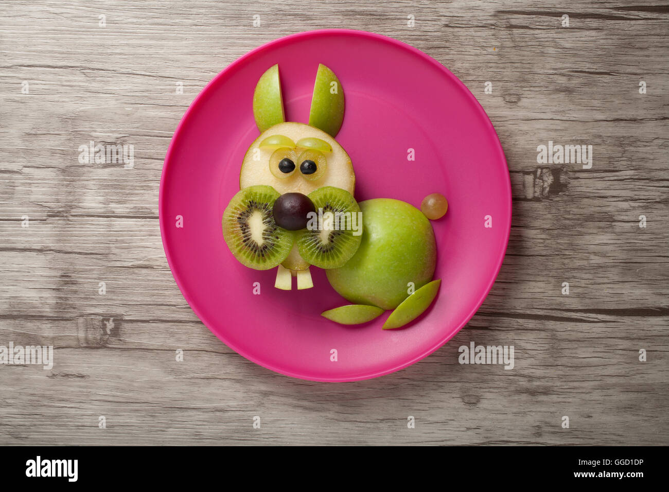 Rabbit made of fruits on plate and board Stock Photo - Alamy