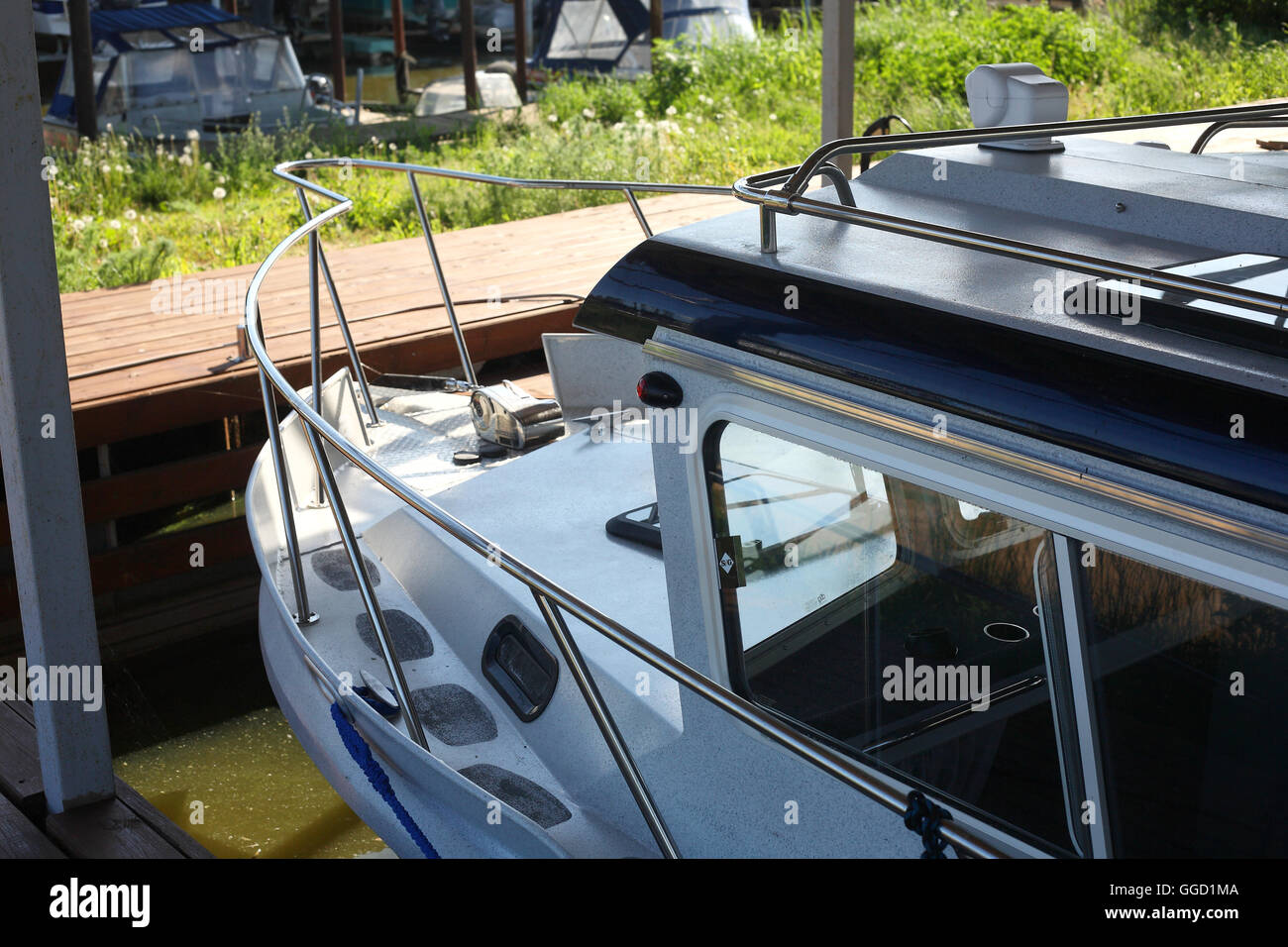 Boats parking - Small boat on the mooring Stock Photo - Alamy