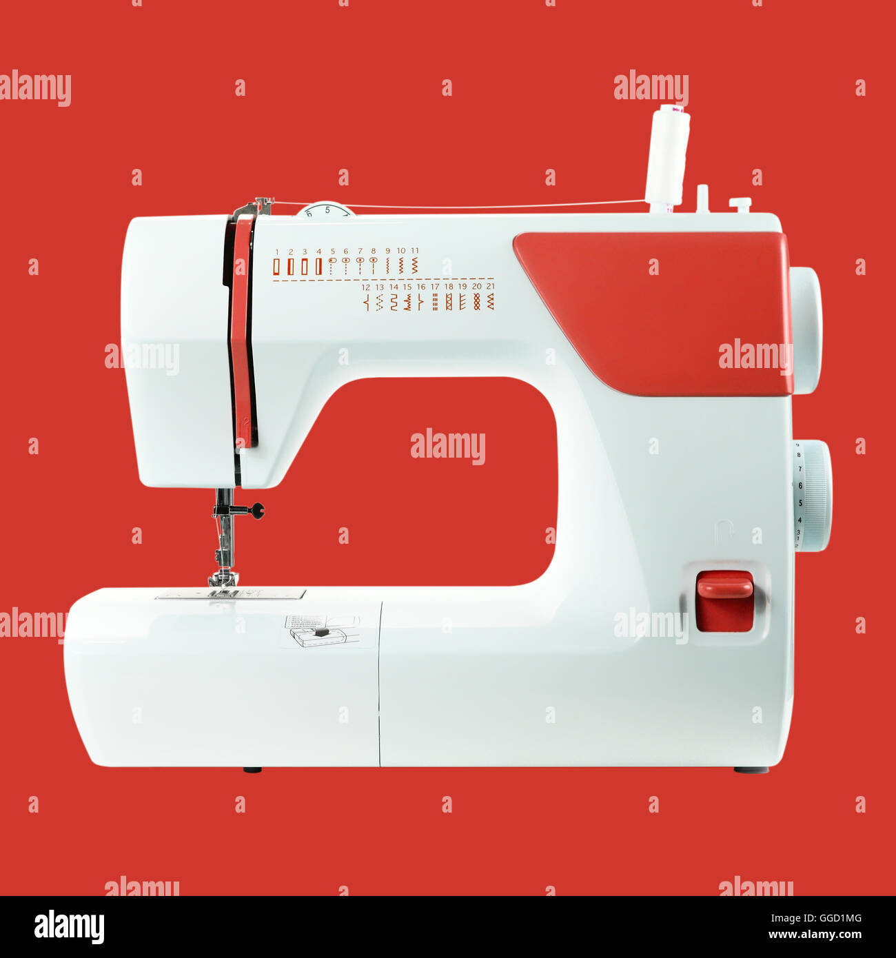 Household appliances - image of the electrical sewing machine on a red ...