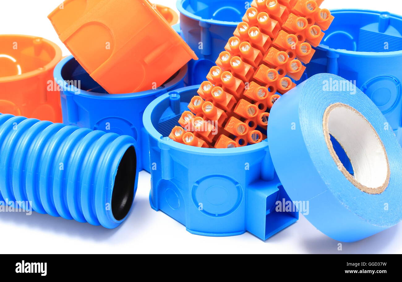 Orange and blue electrical boxes with components for use in electrical ...
