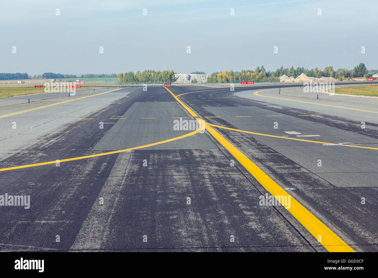 yellow lines on a runway of small airport Stock Photo - Alamy