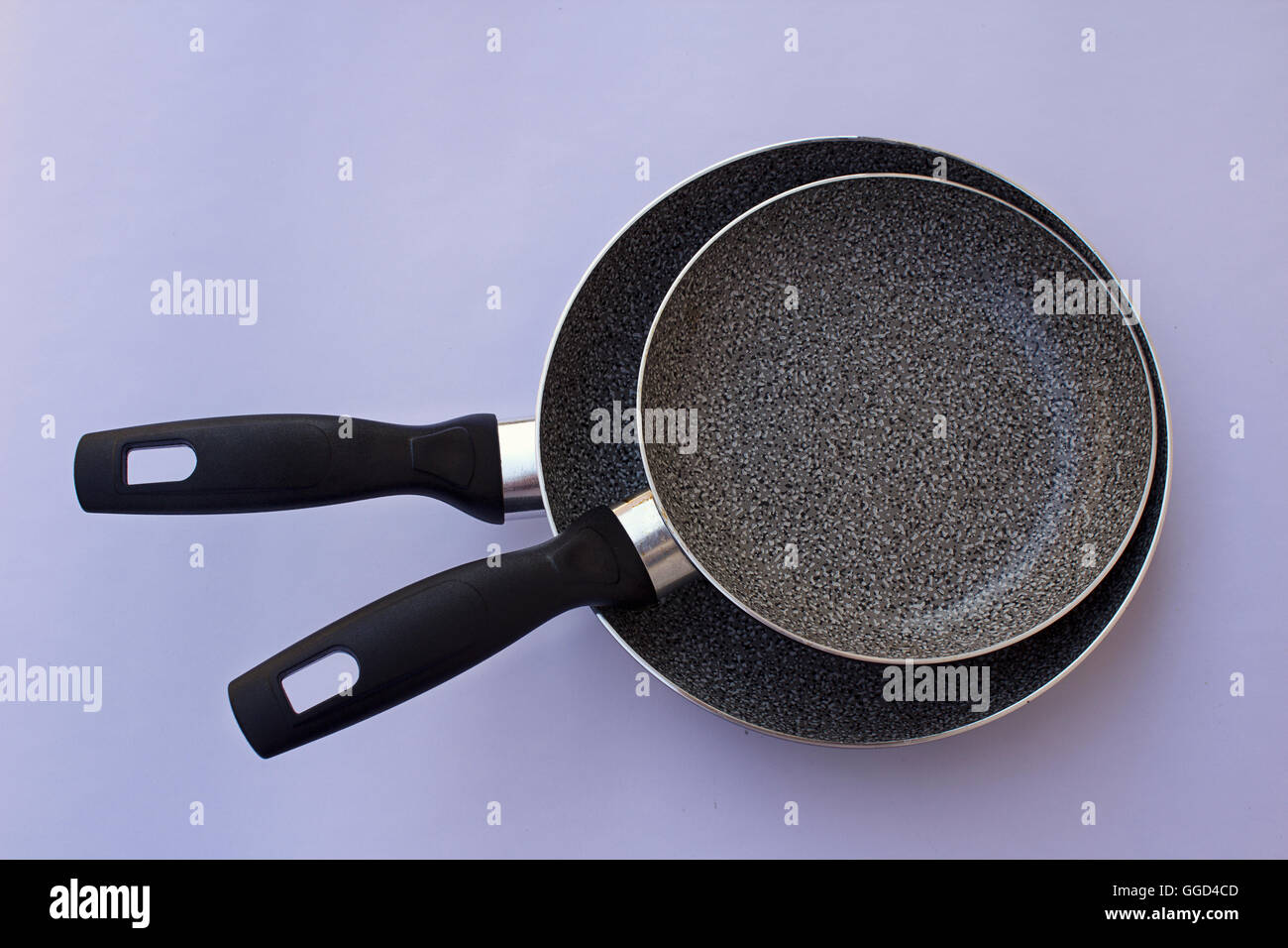 Empty steel frying pan isolated on white background Stock Photo - Alamy