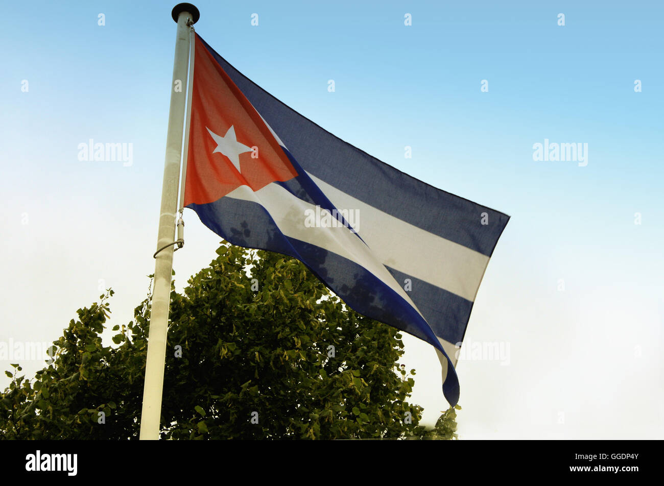 Cuban national flag nad blue sky Stock Photo - Alamy