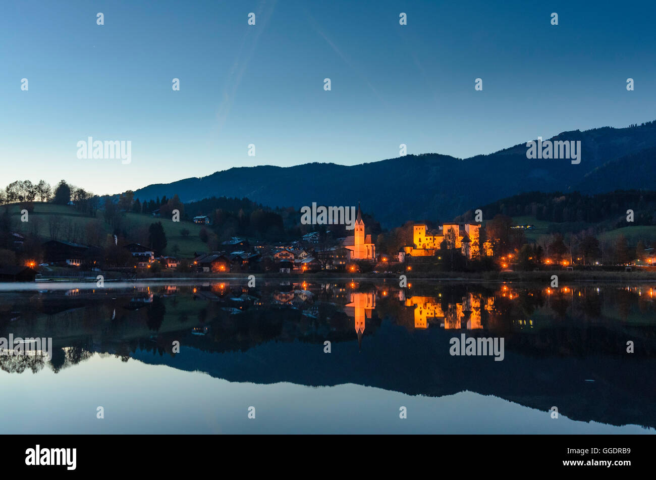 Goldegg: lake Goldeggersee , church and castle Goldegg, Austria ...