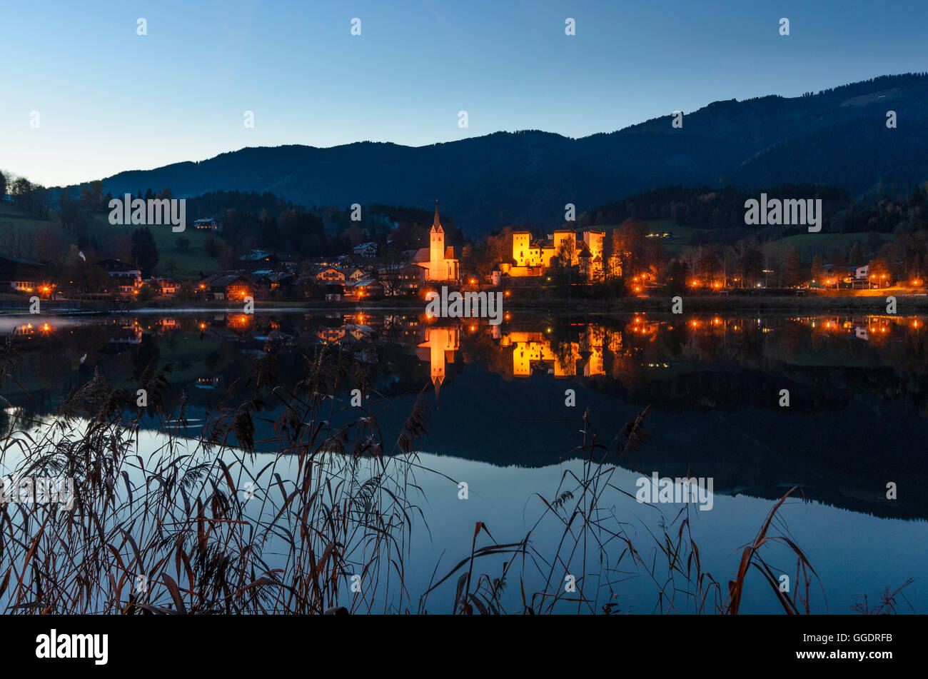 Goldegg: lake Goldeggersee , church and castle Goldegg, Austria ...