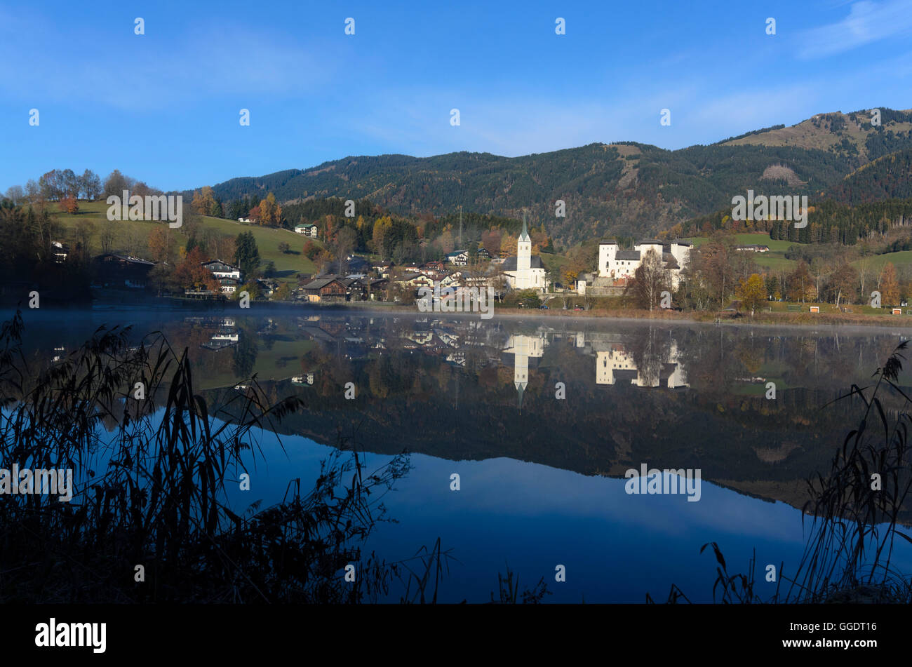 Goldegg: lake Goldeggersee , church and castle Goldegg, Austria ...