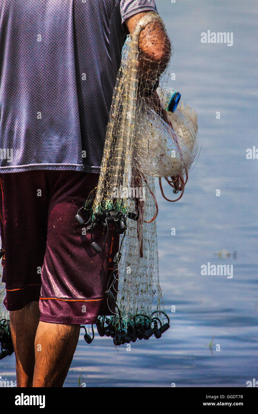 Man fishing with nets Stock Photo - Alamy