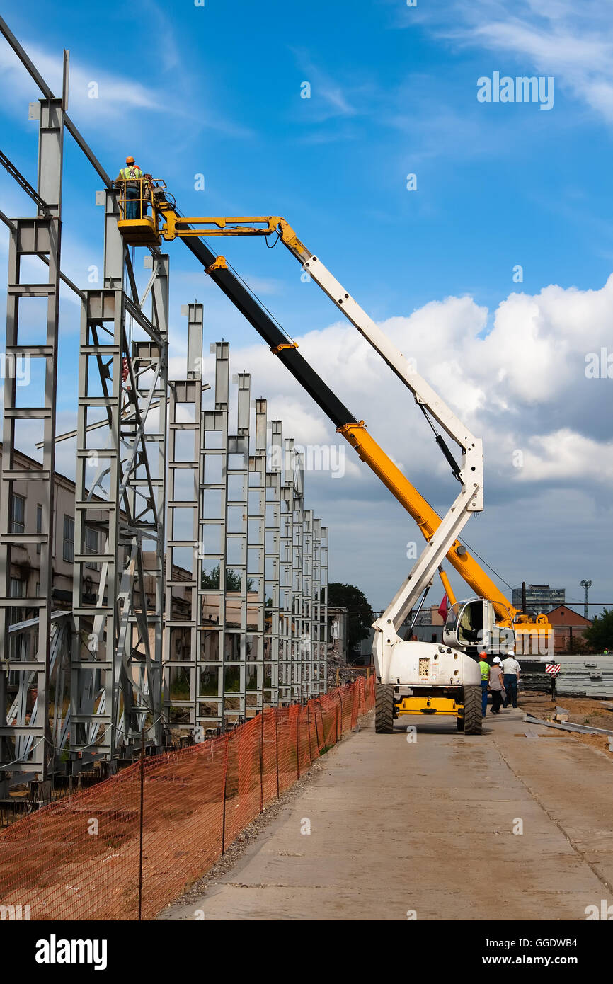 Hoist and crane involved in the installation of metal structures for ...