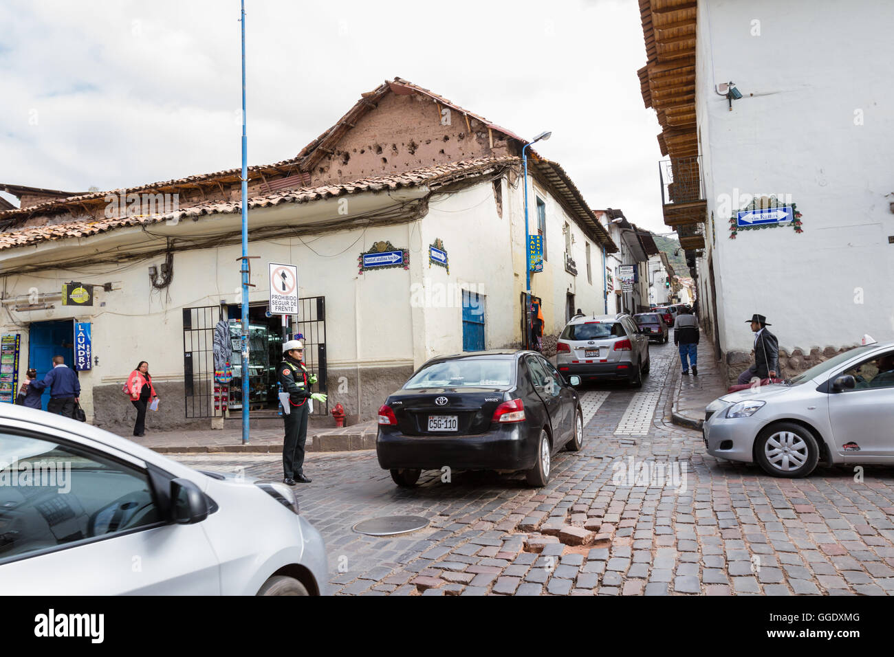 Cusco, Peru - May 12 : Police woman directing traffic on a busy ...