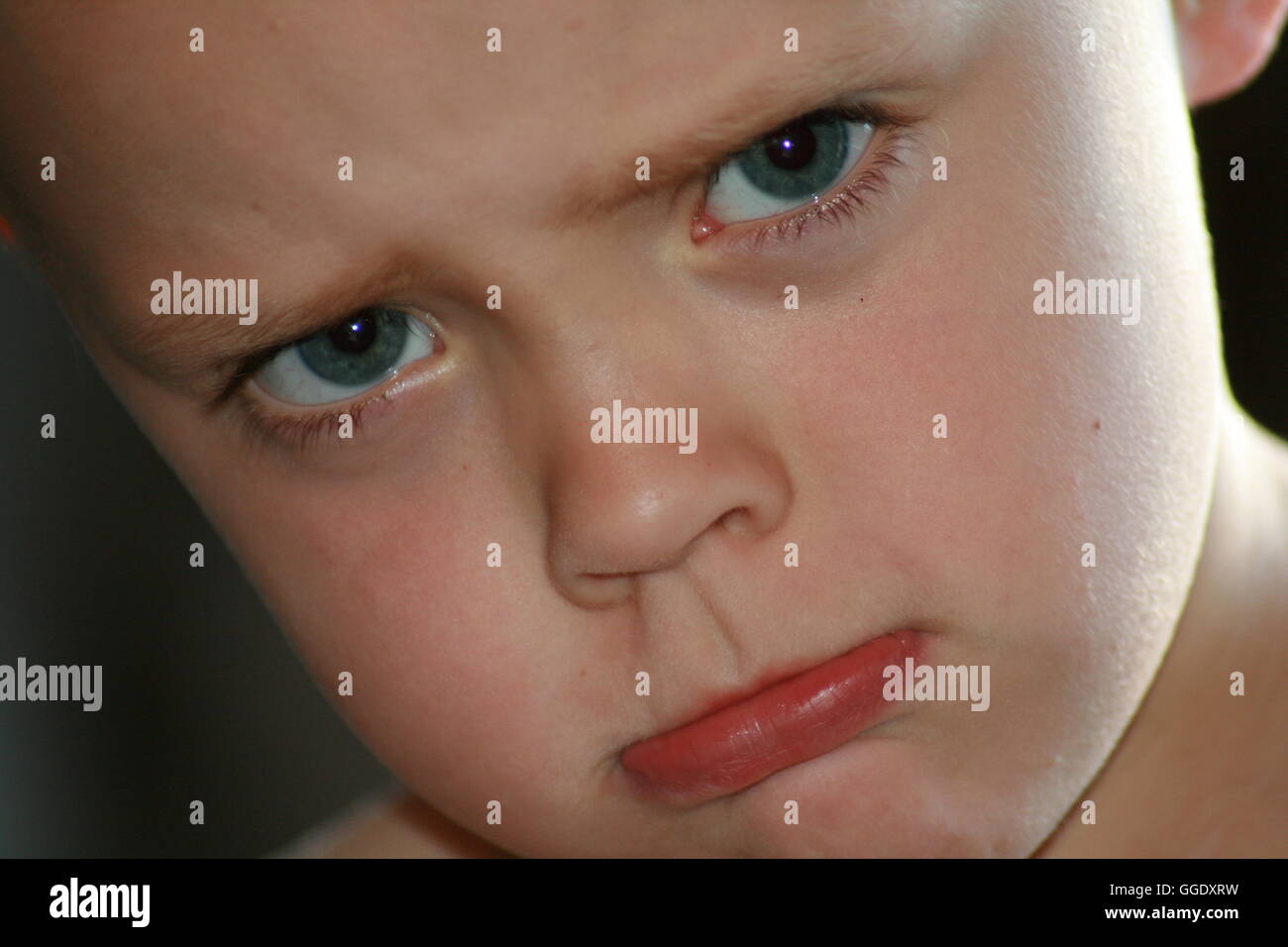 Boy sticking out bottom lip hi-res stock photography and images - Alamy