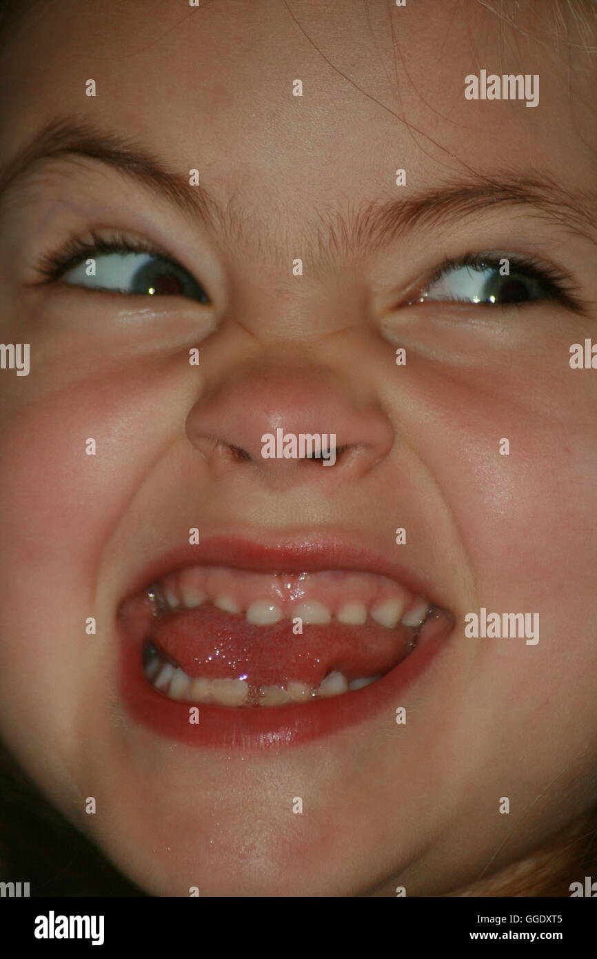 girl pulling a face Stock Photo - Alamy