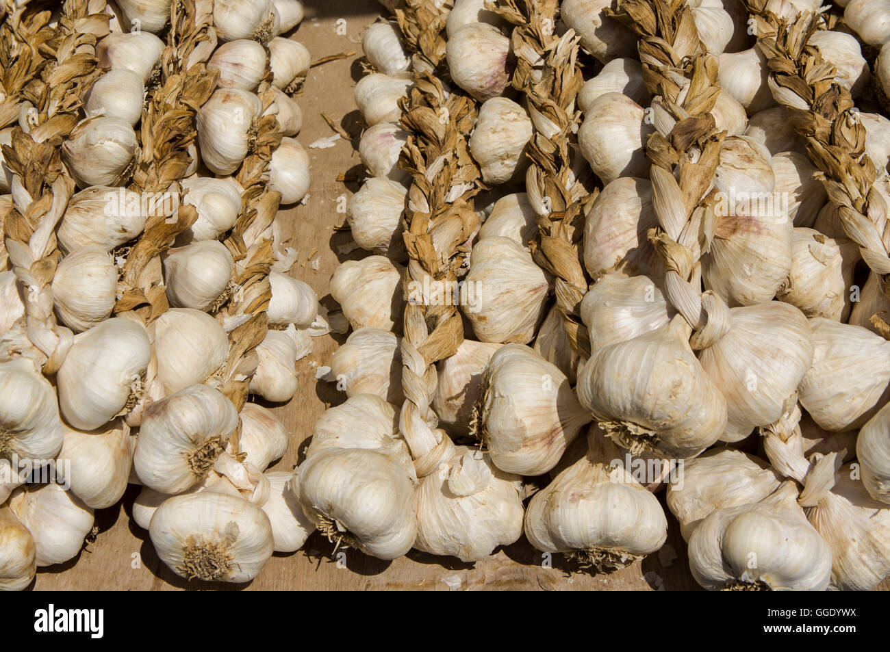 garlic braid in the bazzar Stock Photo - Alamy