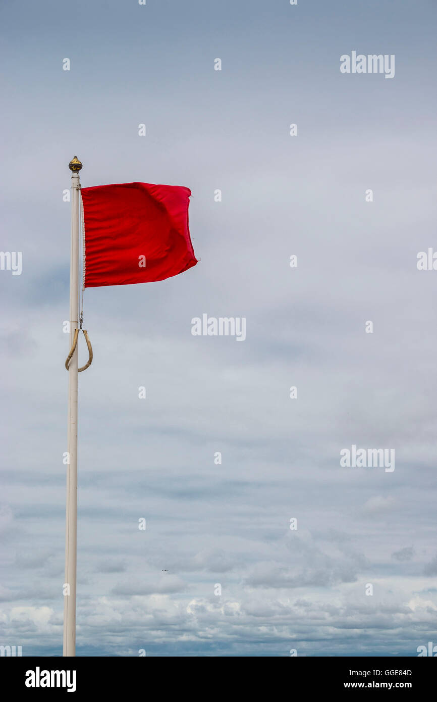 red flag flying by the sea at Blackpool Stock Photo - Alamy