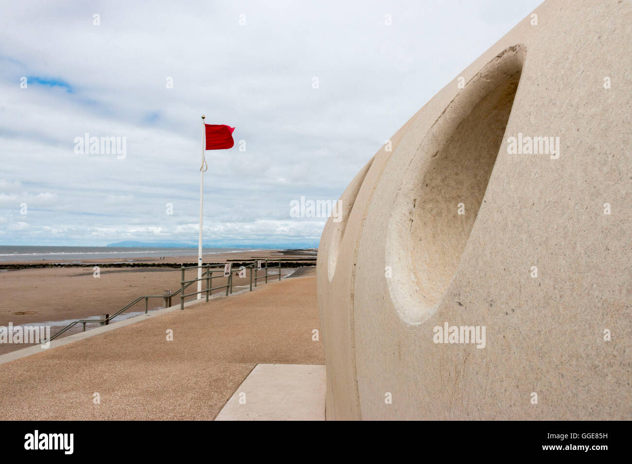 red danger flag by the concrete sea defences at Blackpool Stock Photo ...