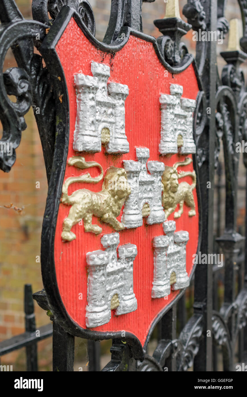 A Winchester City crest on railings by a park near the King Alfred ...