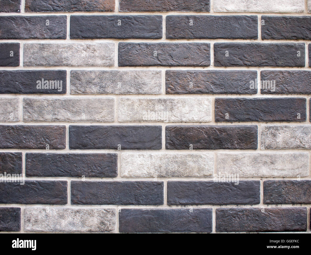 Detail of decorative brickwork close-up of white and black bricks to be ...