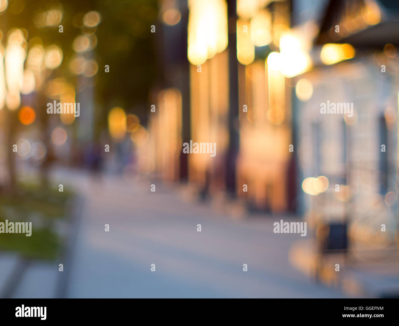 Blurred and out of focus image of streets and buildings that lit the ...