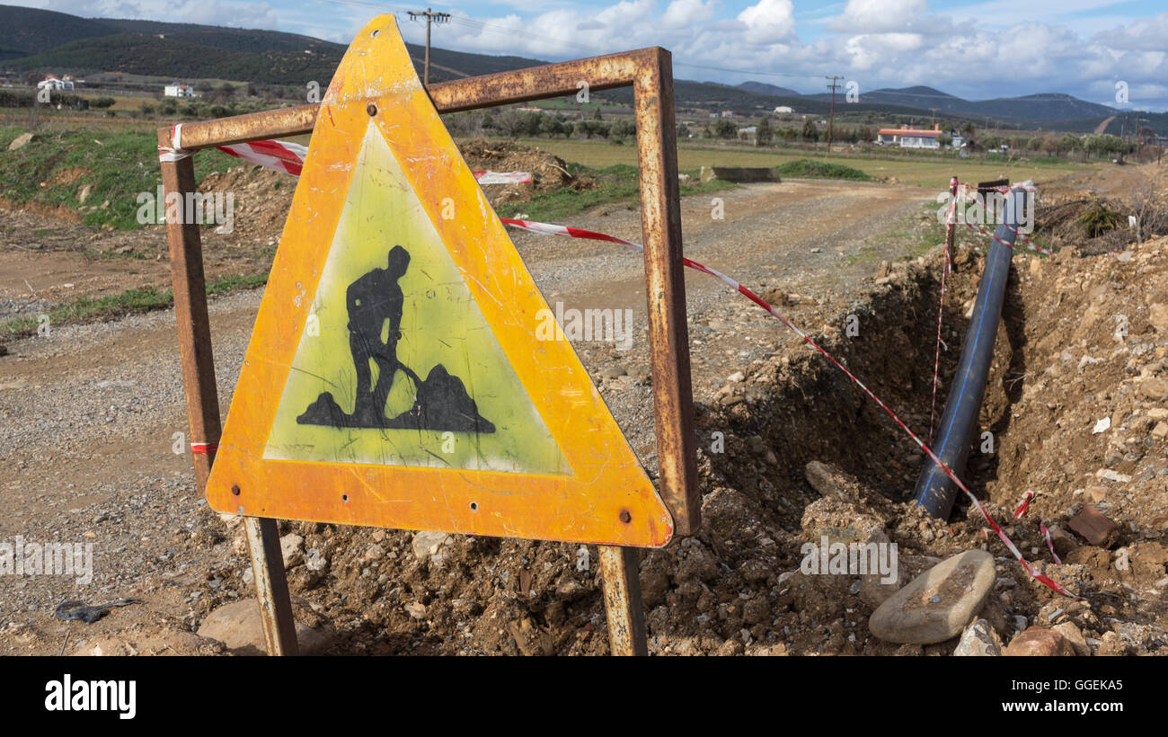 sign indicating road work under contraction Stock Photo - Alamy