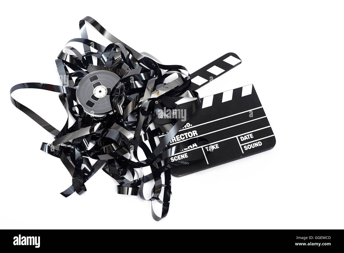 Movie clapper board with video tape on white background Stock Photo - Alamy